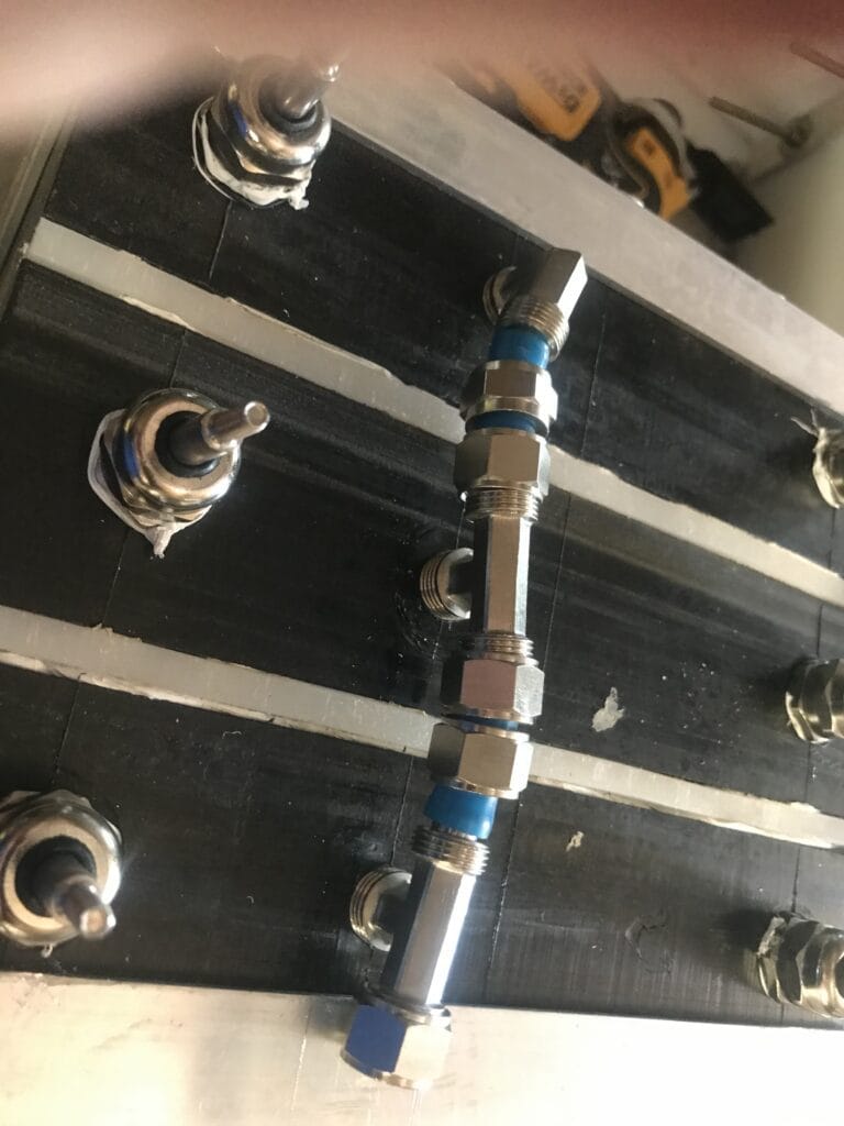 FITTING THE METAL GAS FITTINGS TO THE CELLS